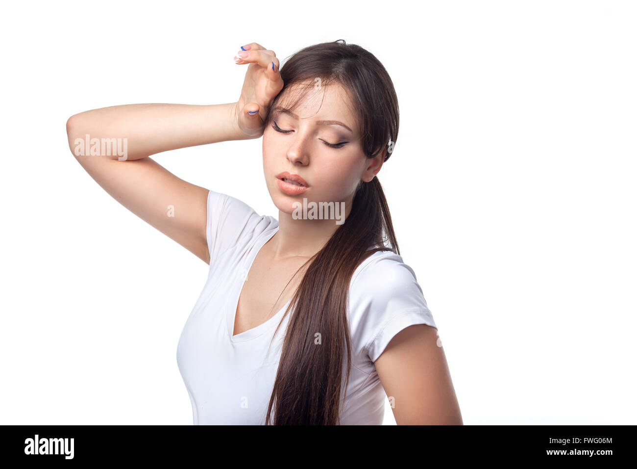 Tired young woman over white background Stock Photo - Alamy