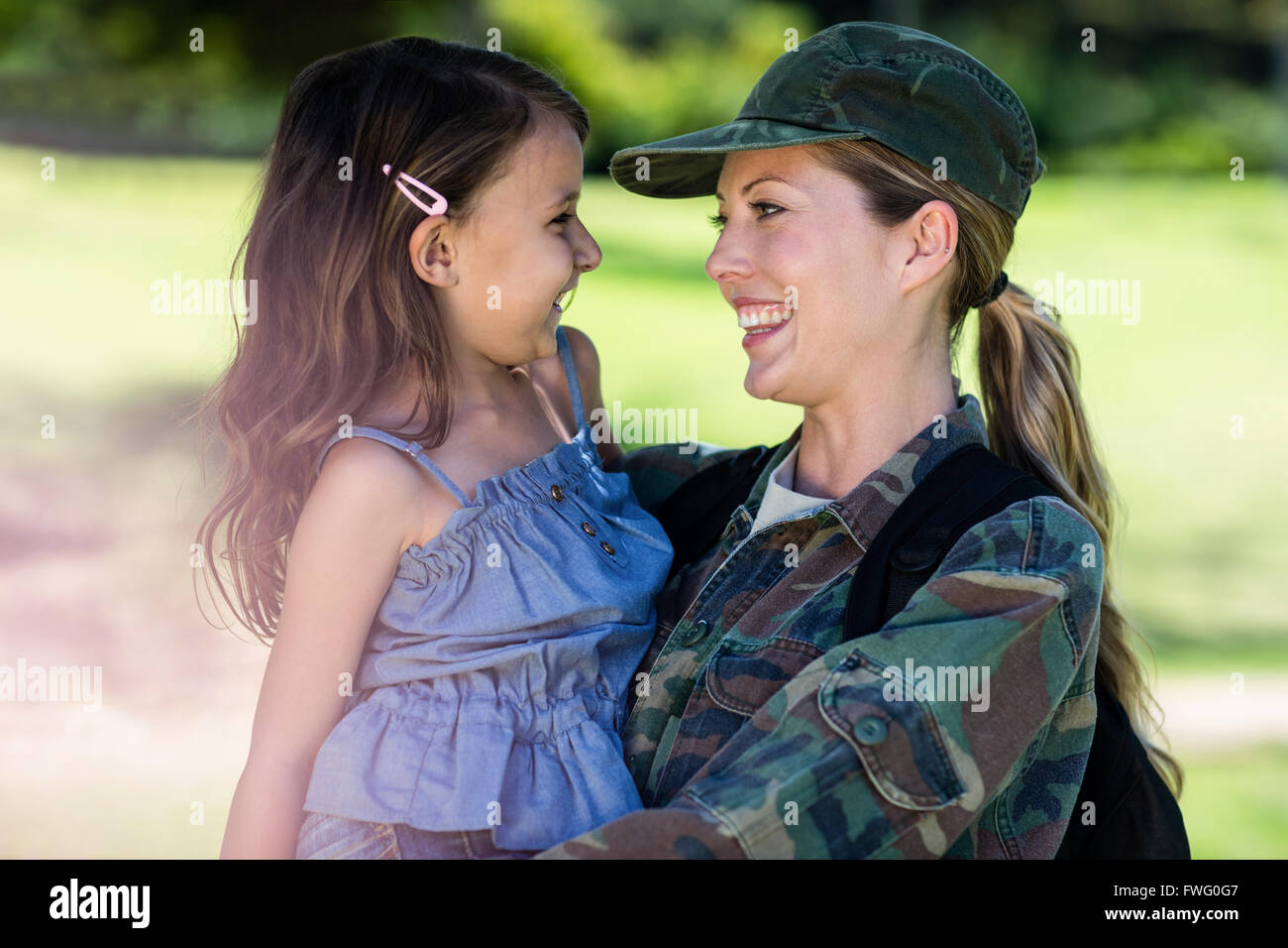 Military with family smiling carrying daughter hi-res stock photography ...