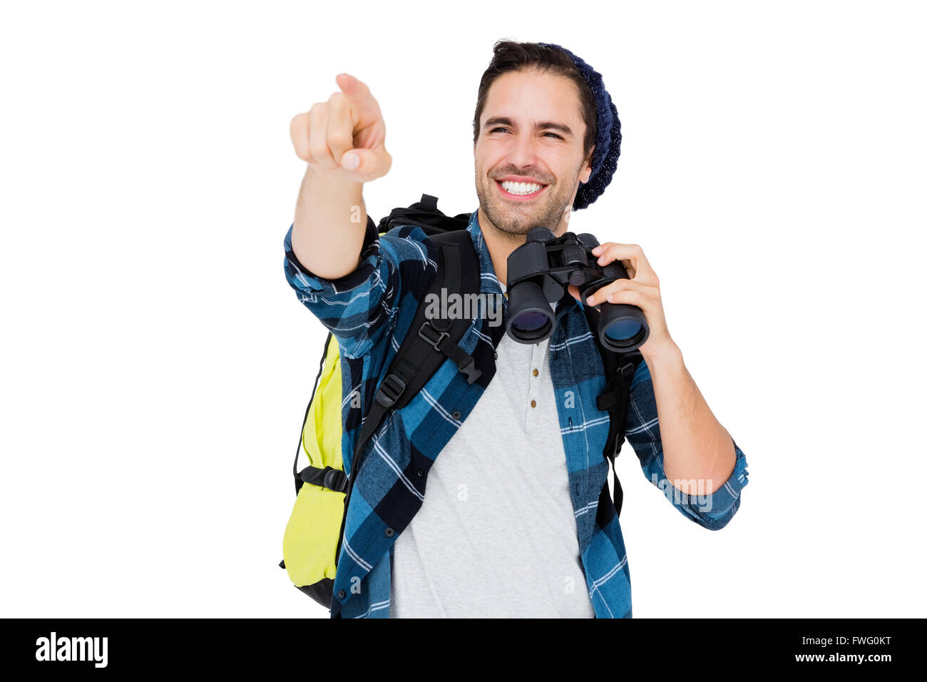 Young man carrying rucksack and using camera Stock Photo - Alamy