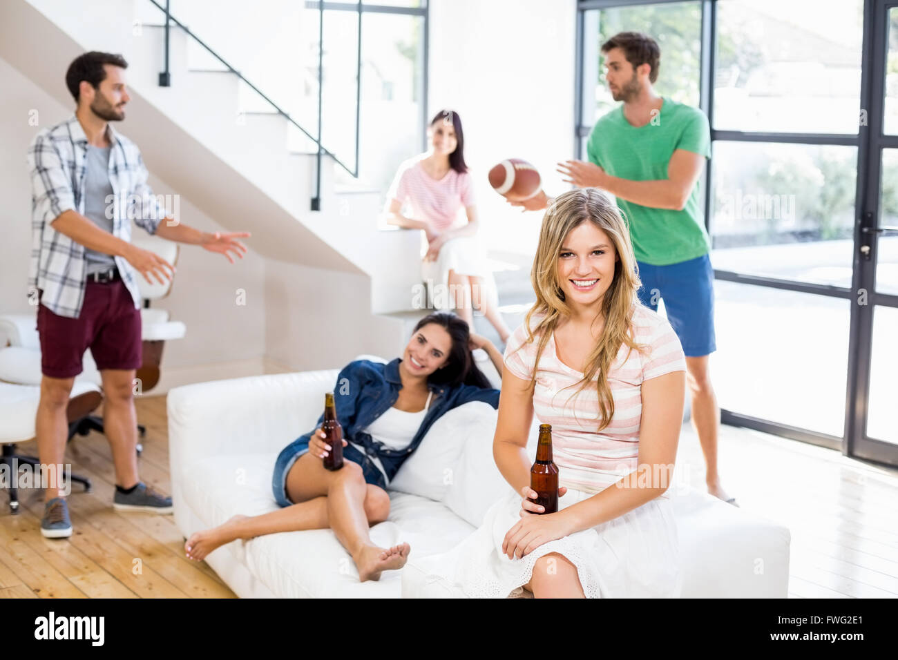 Playful friends having fun together Stock Photo - Alamy
