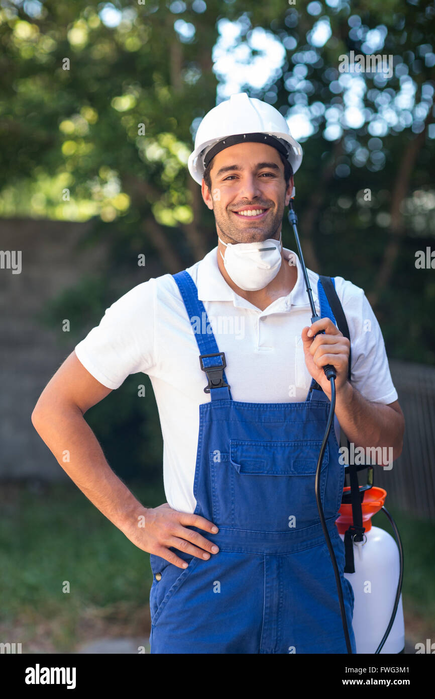 Portrait of confident insecticide worker Stock Photo - Alamy
