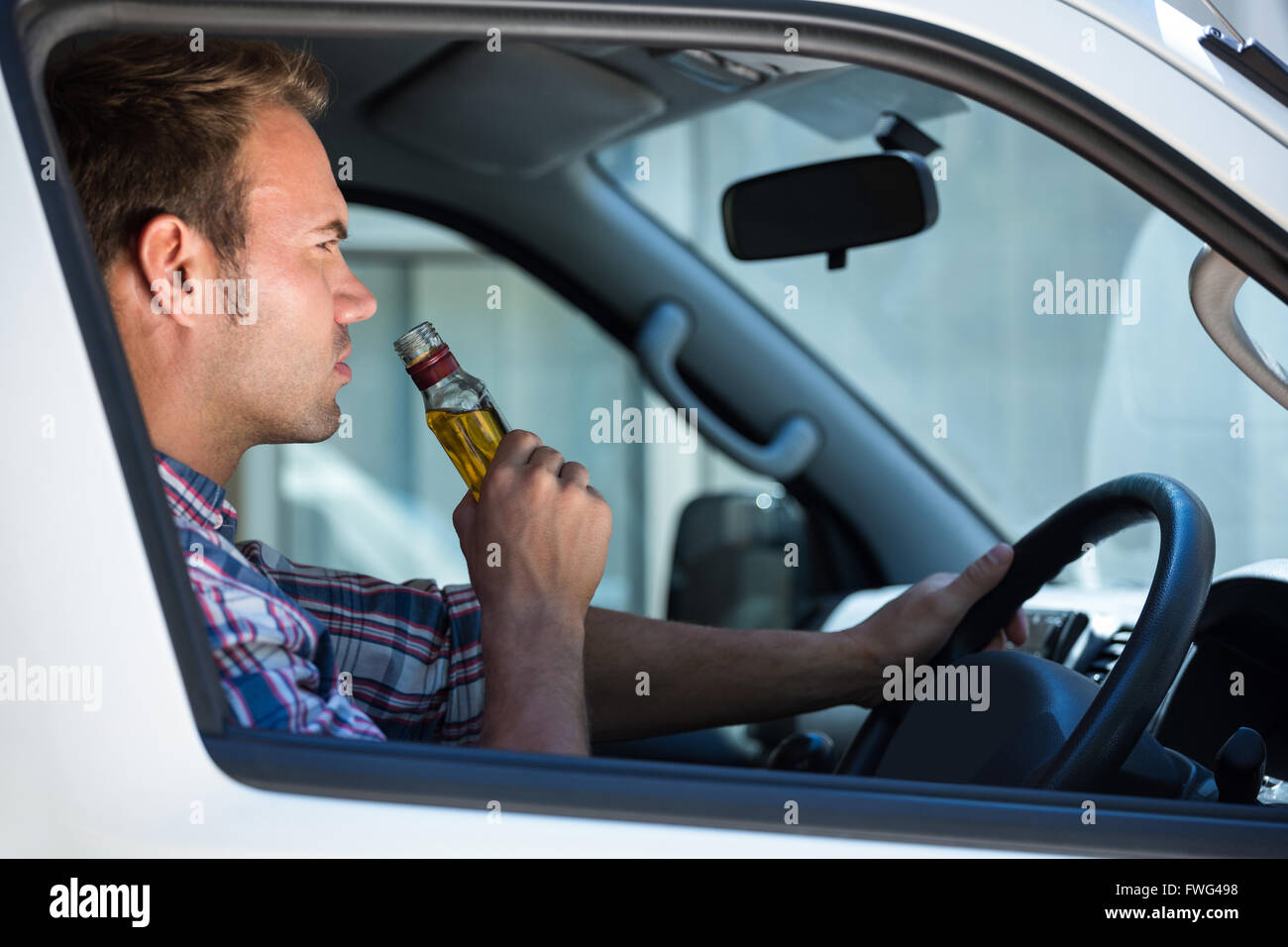 Man drinking beer while driving Stock Photo - Alamy