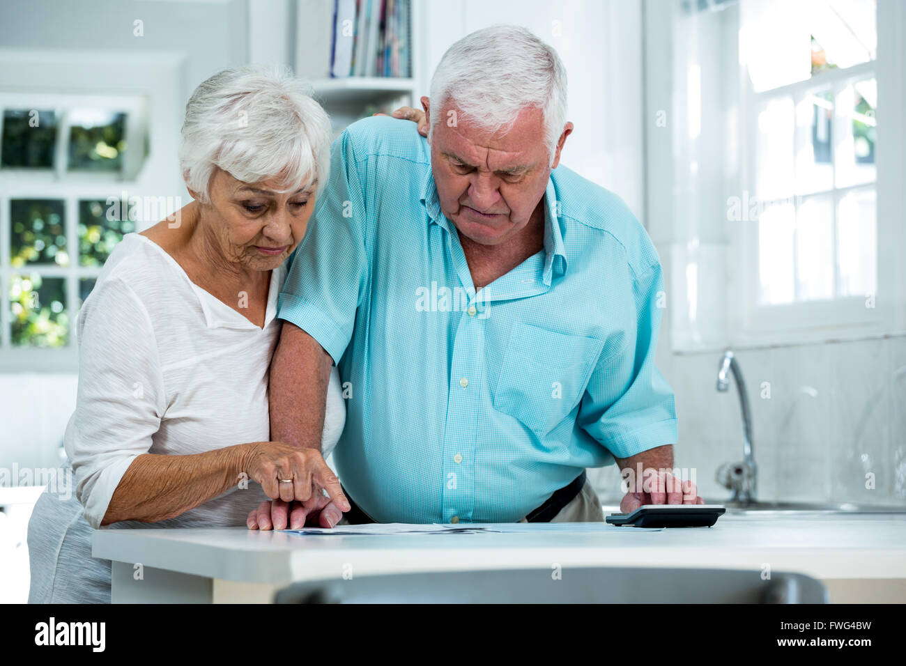 Woman man senior calculator hi-res stock photography and images - Alamy