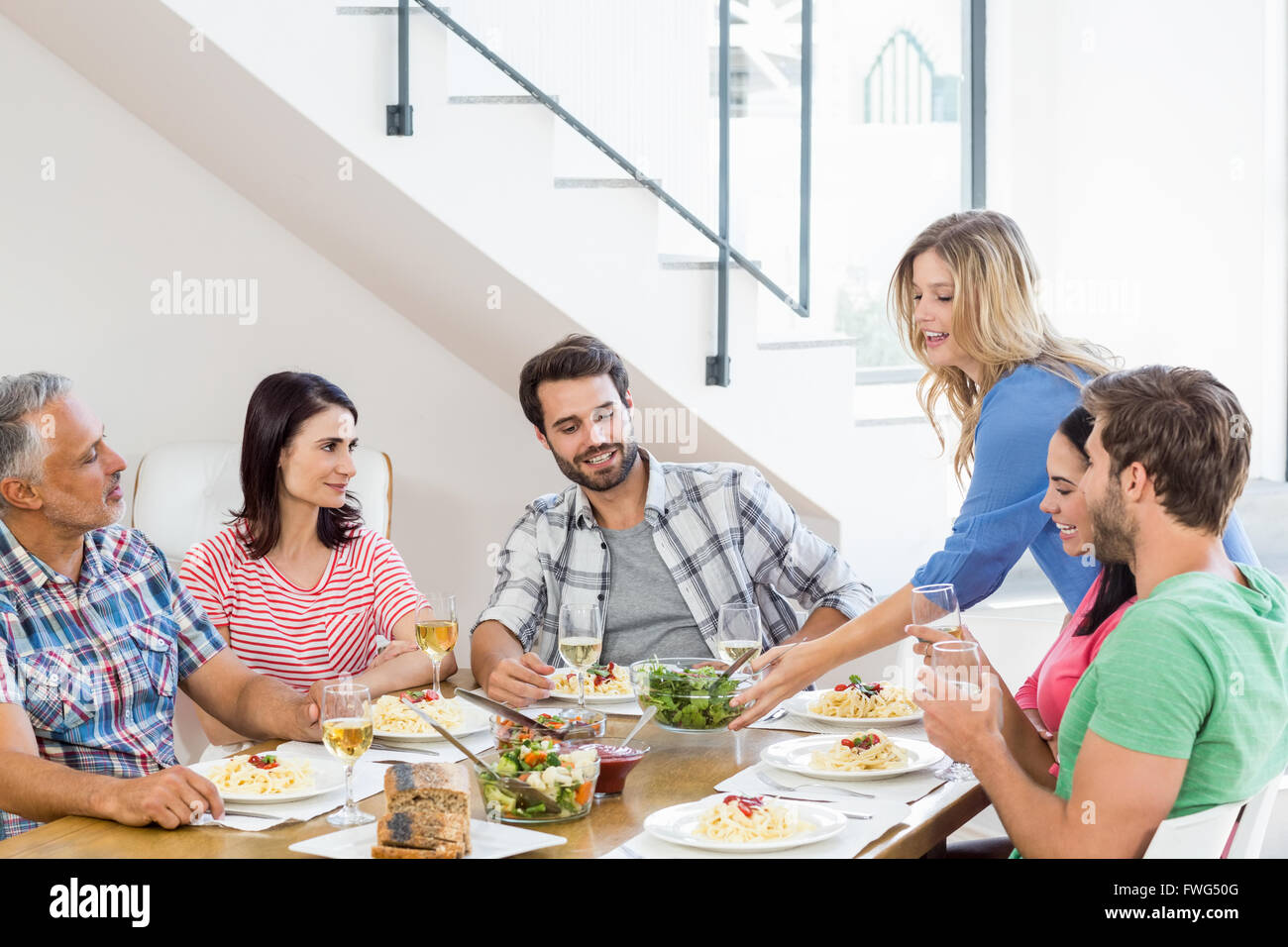 Friends having meal together Stock Photo - Alamy