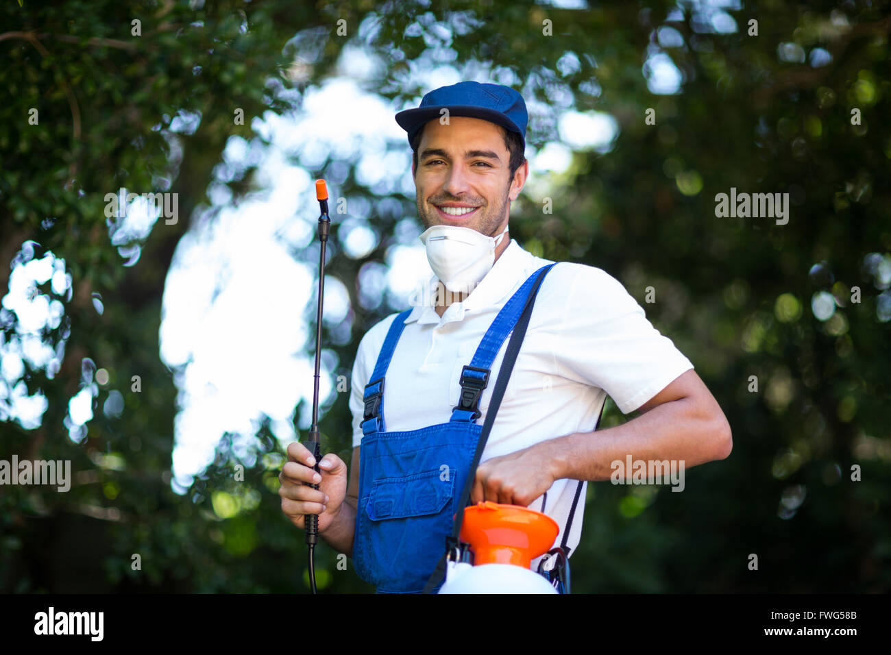 Portrait of happy insecticide worker Stock Photo - Alamy
