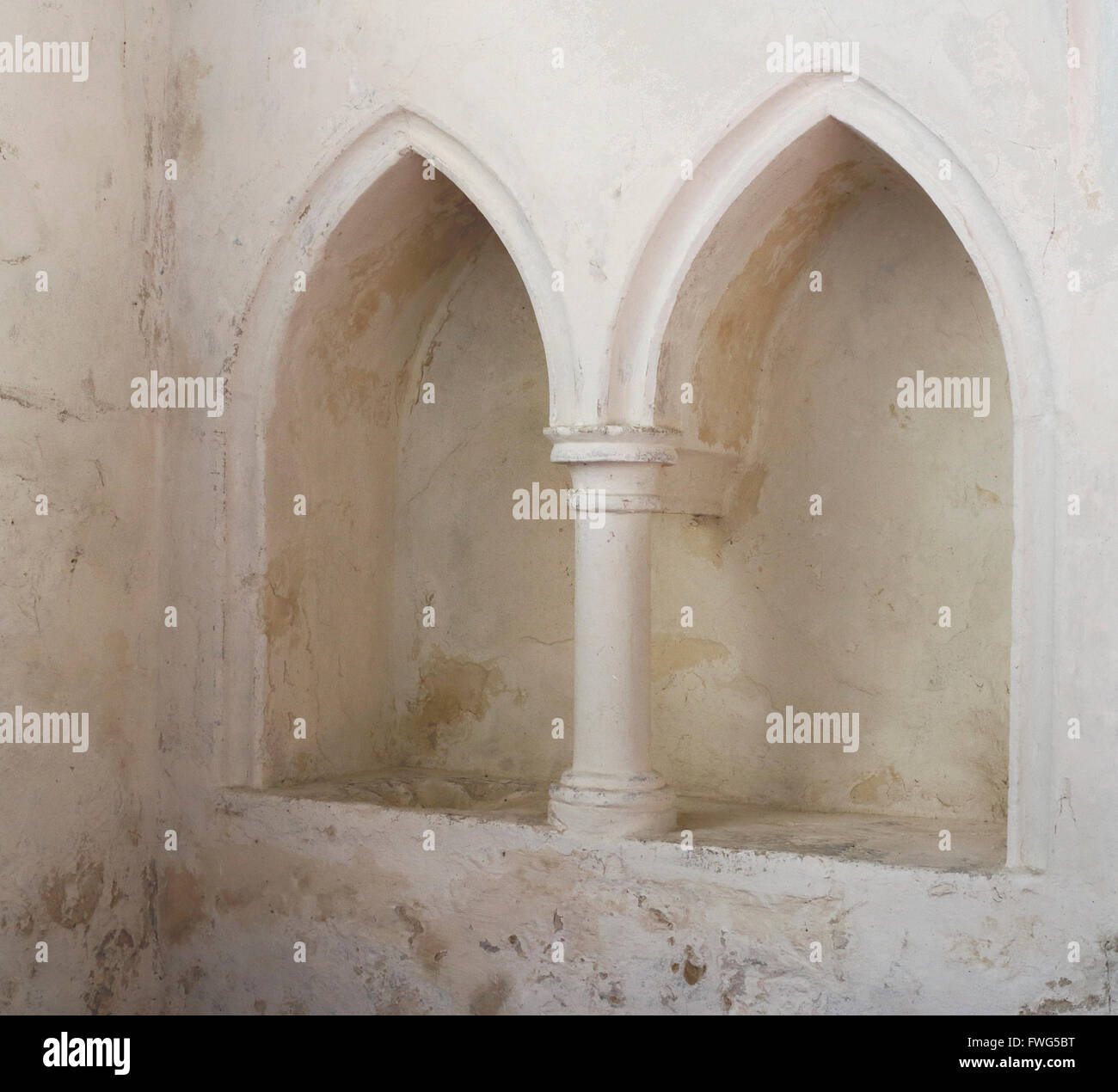 Piscina in double arch recess at the church of St John the Baptist at ...