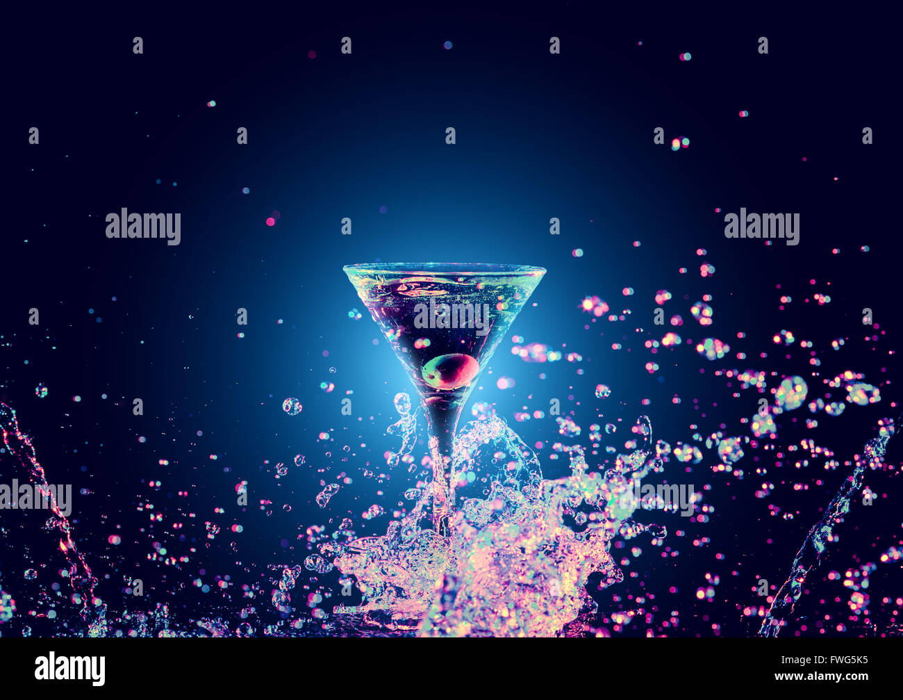 Colourful cocktail in glass with splash Stock Photo - Alamy