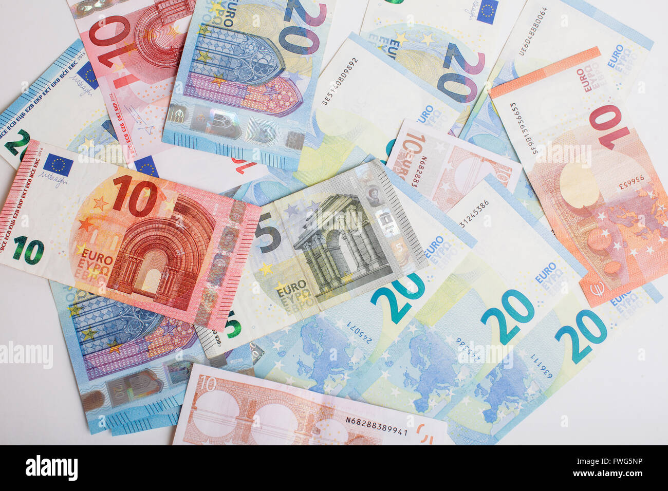 Cash on table isolated: dollars, euro, rubl broken money. All in mess ...