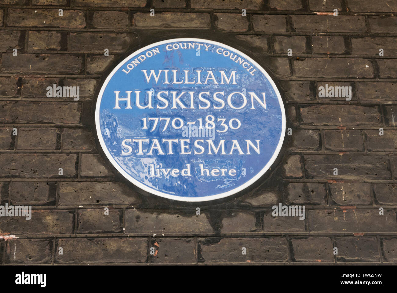 Commemorative blue plague of William Huskisson (1770-1830) on the wall ...