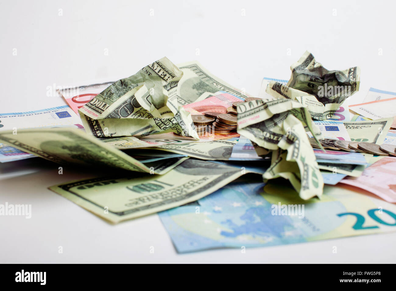 Cash on table isolated: dollars, euro, rubl broken money. All in mess ...