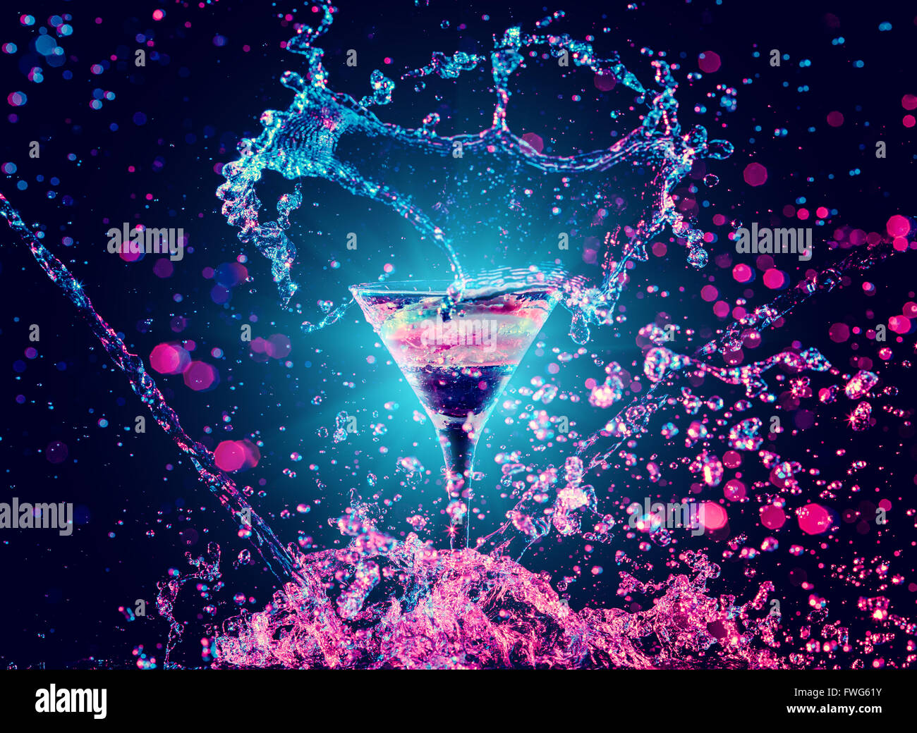 Colourful cocktail in glass with splash Stock Photo - Alamy