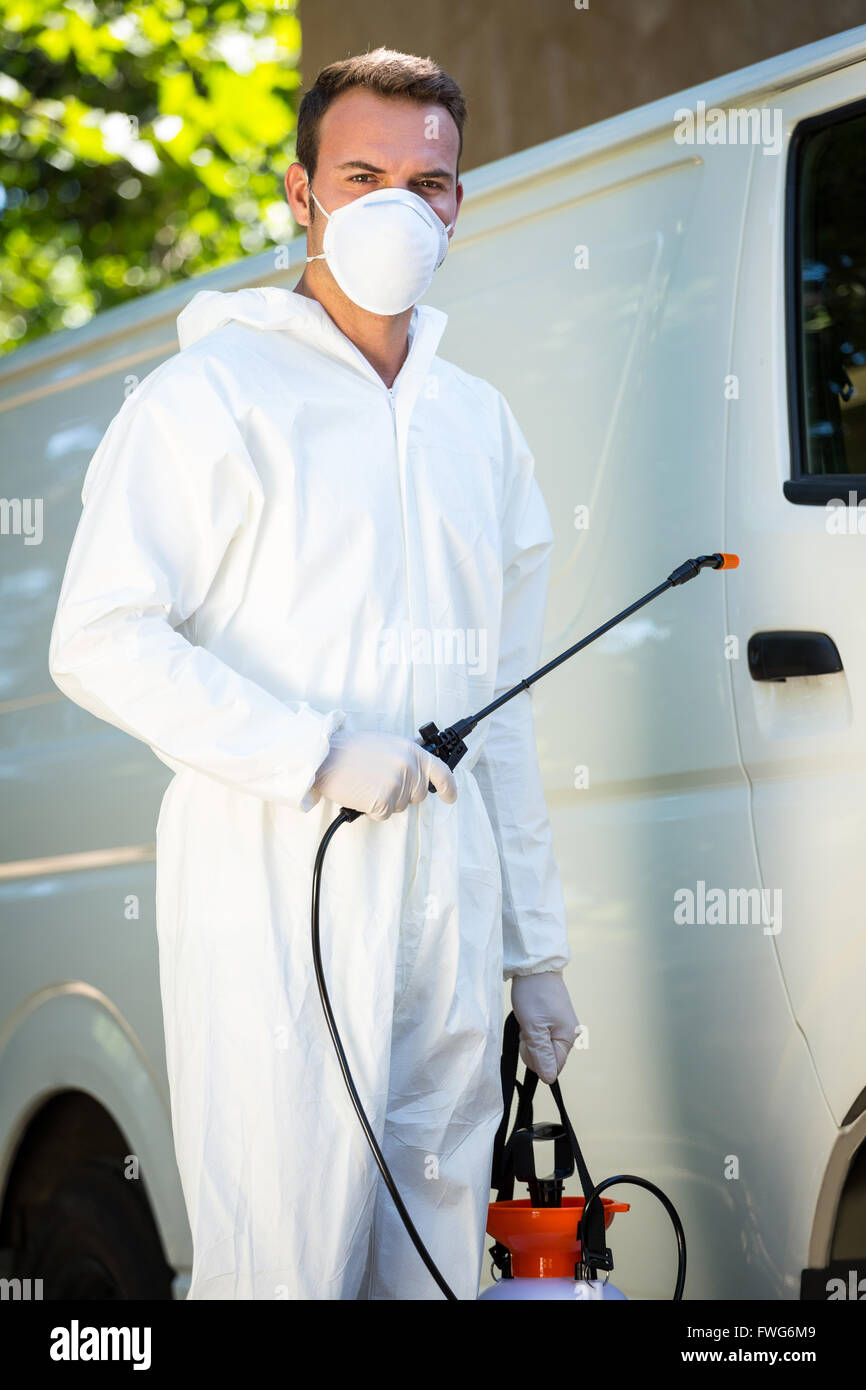 Portrait of pest control man standing next to a van Stock Photo - Alamy