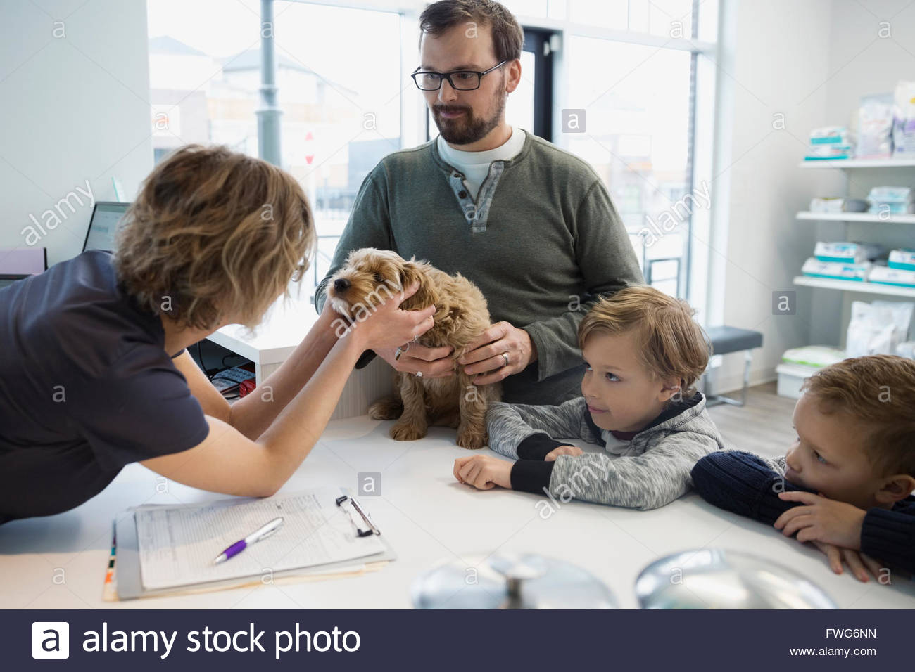 Boy at reception desk hi-res stock photography and images - Alamy
