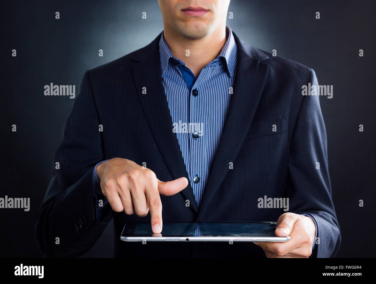 business young man searching in the web with his table Stock Photo - Alamy
