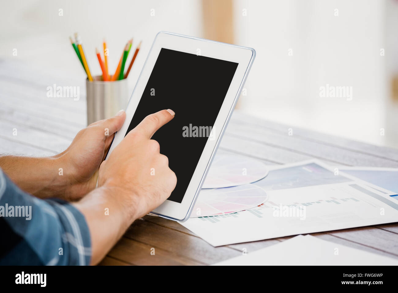 Man using digital at his desk Stock Photo - Alamy