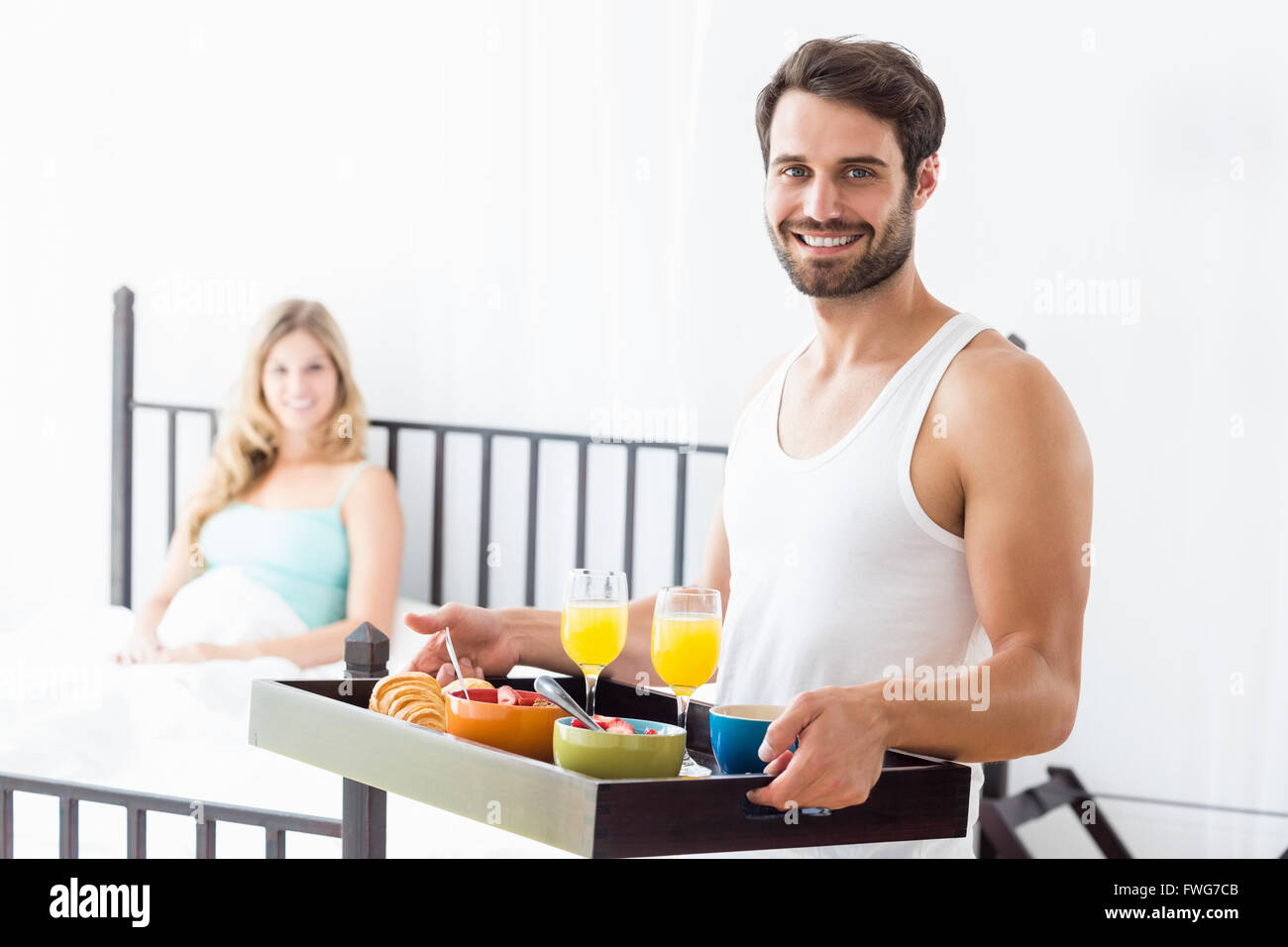 Man serving breakfast to woman Stock Photo - Alamy