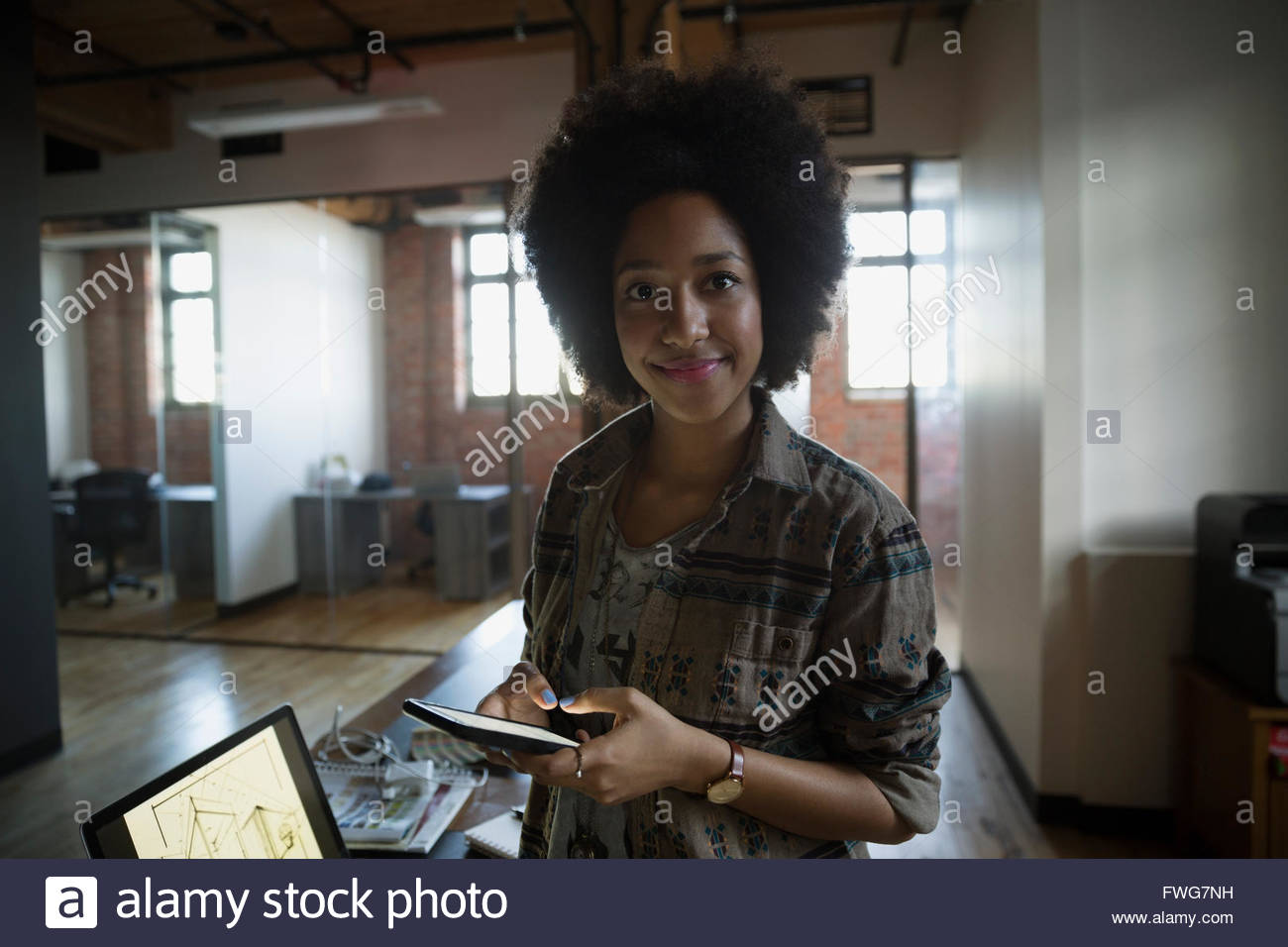 Portrait confident designer texting in office Stock Photo - Alamy