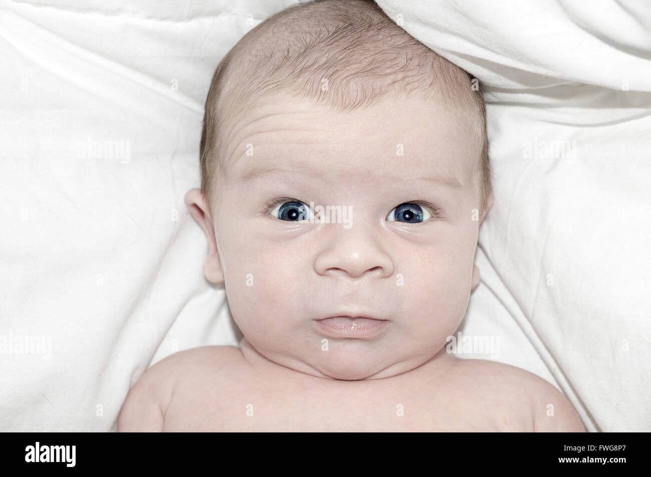 Baby Boy with Bright, Wide Eyes Stock Photo - Alamy