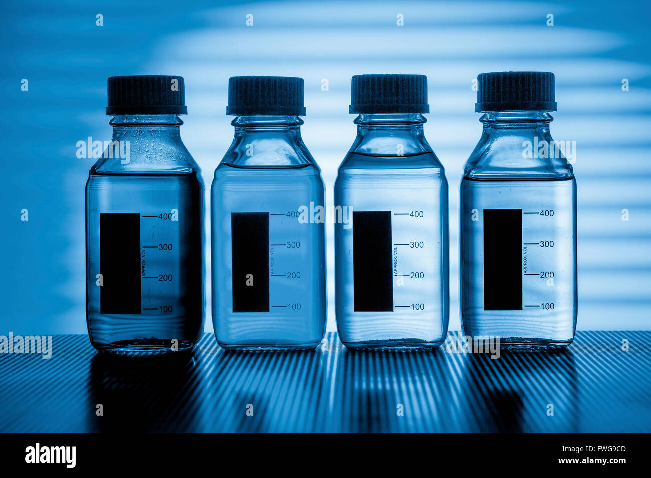Transparent liquids in plastic bottles Stock Photo - Alamy