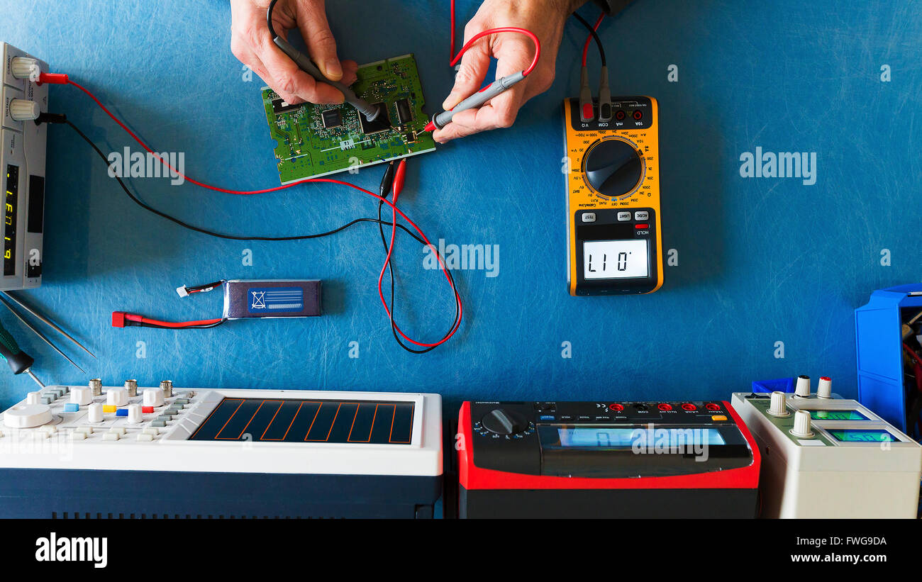 Person working with electronic measuring instruments Stock Photo - Alamy