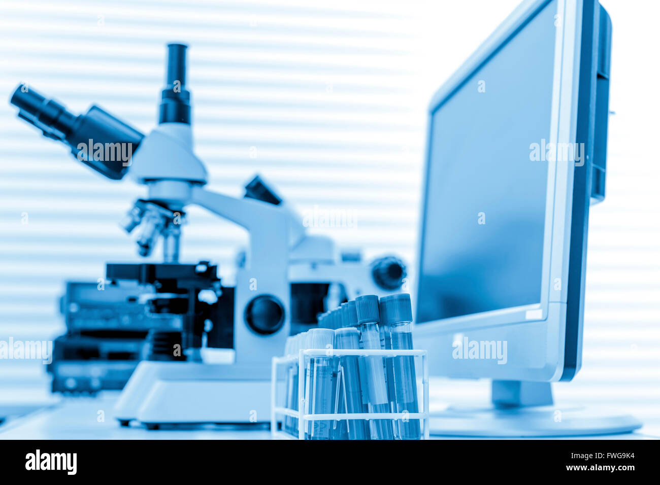 Microscope and computer monitor in the laboratory Stock Photo - Alamy