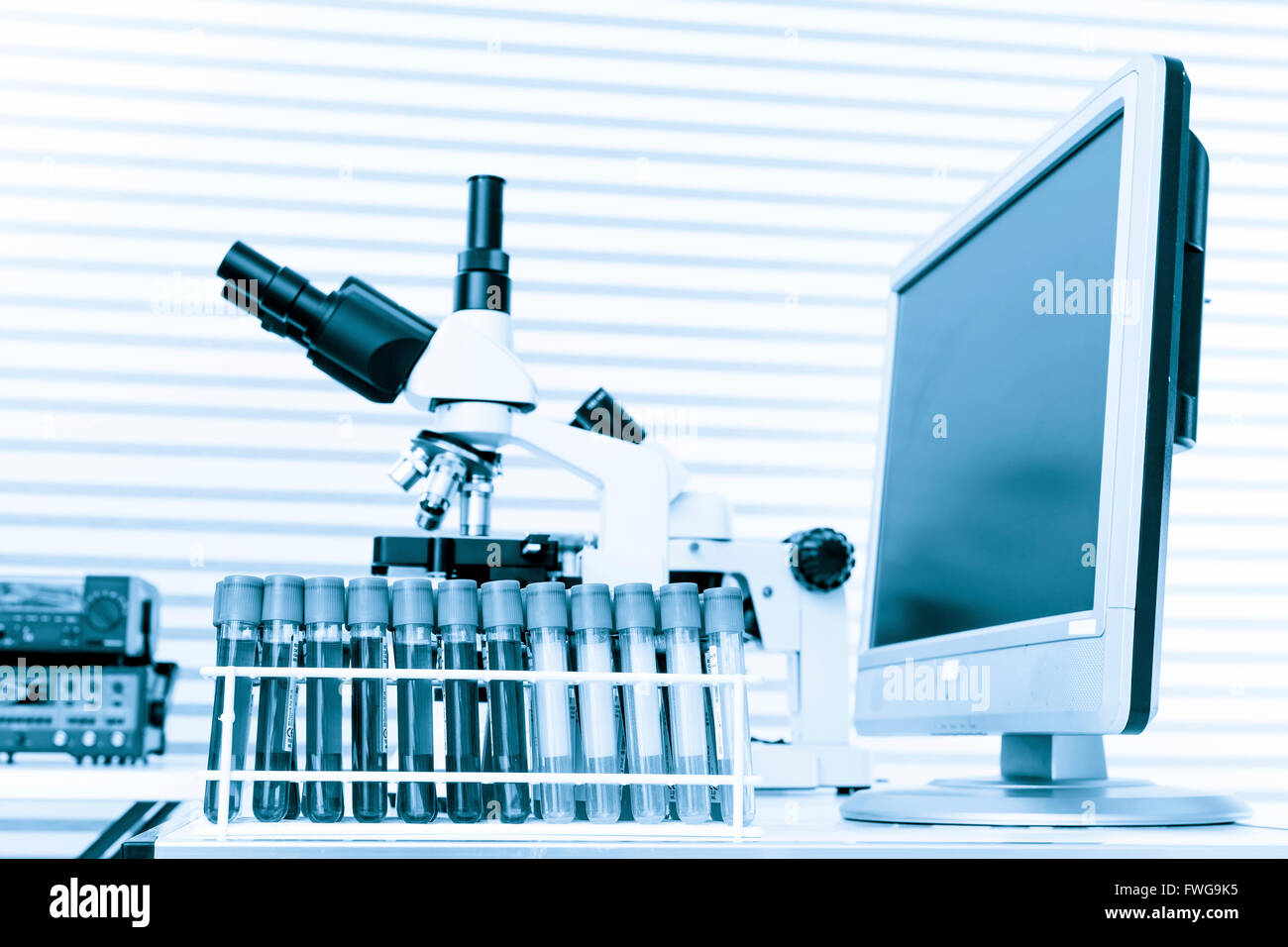 Microscope and computer monitor in the laboratory Stock Photo - Alamy