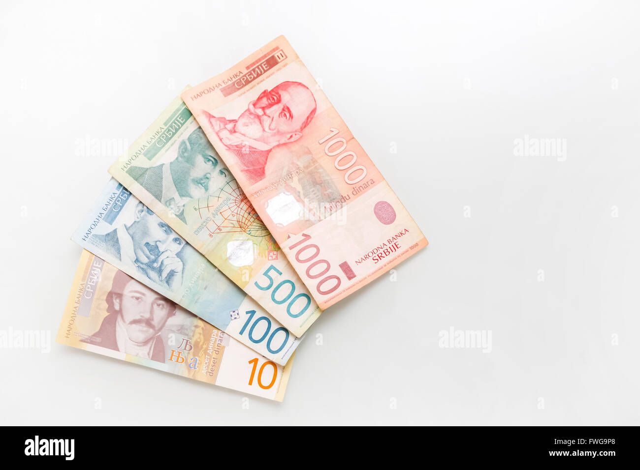 Different Serbian dinar bills arranged on white background Stock Photo ...