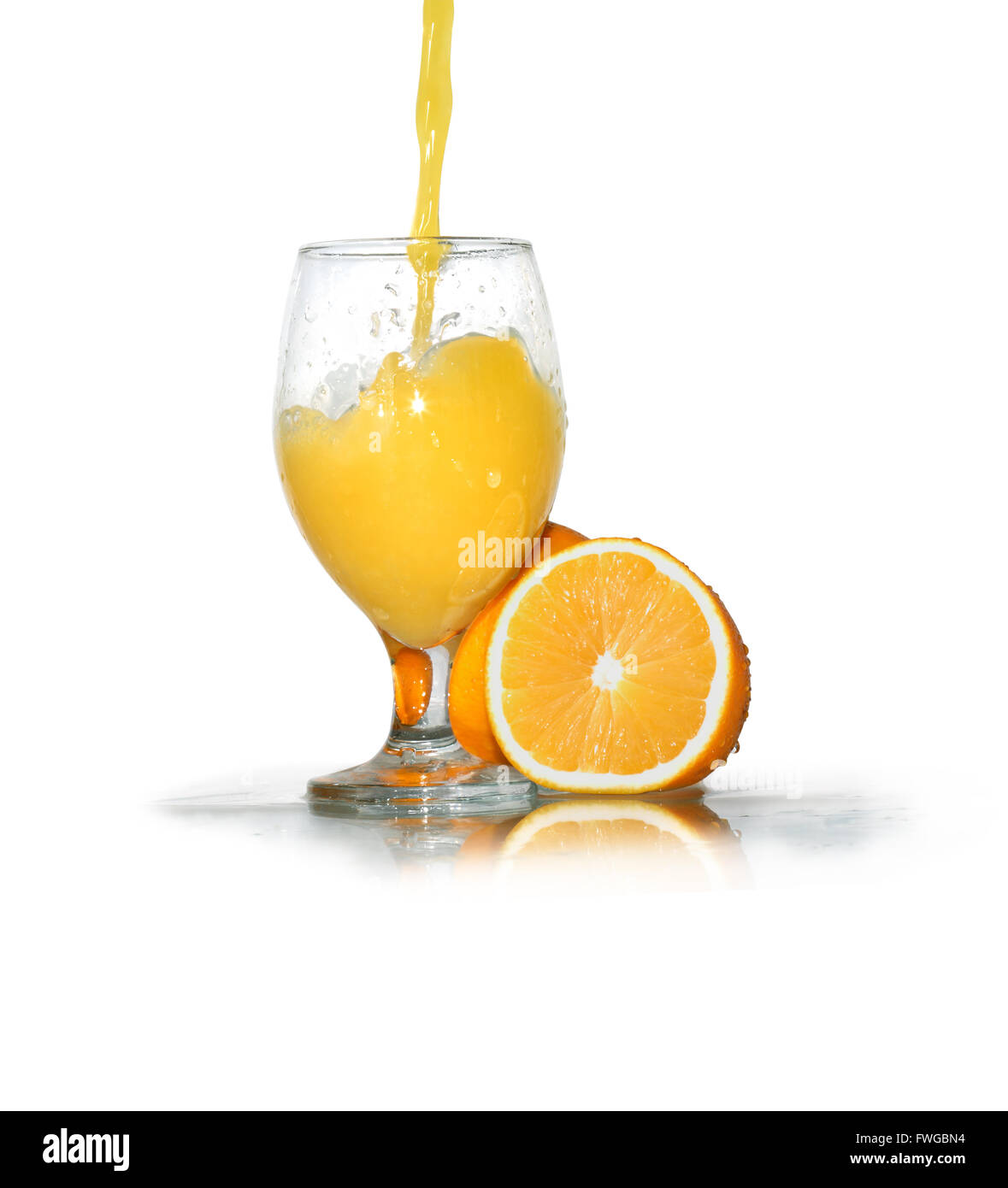 Orange juice flowing to glass near fruits on white background. Clipping ...