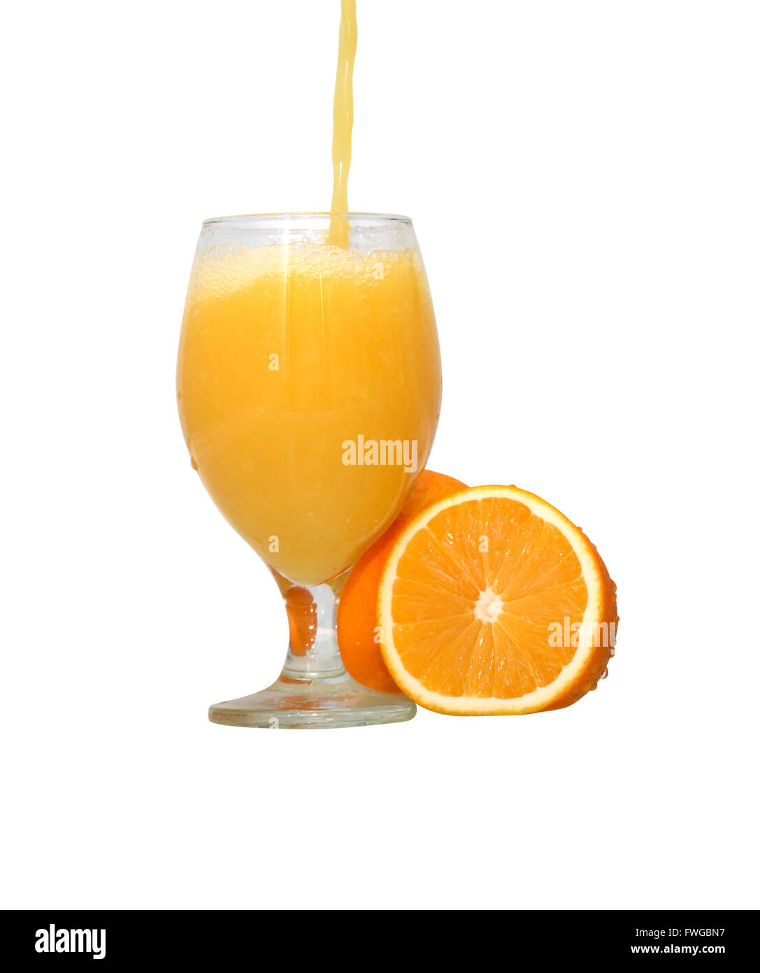 Orange juice flowing to glass near fruits on white background. Clipping ...