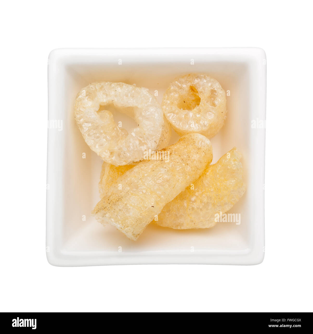 Dried fish maw in a square bowl isolated on white background Stock ...