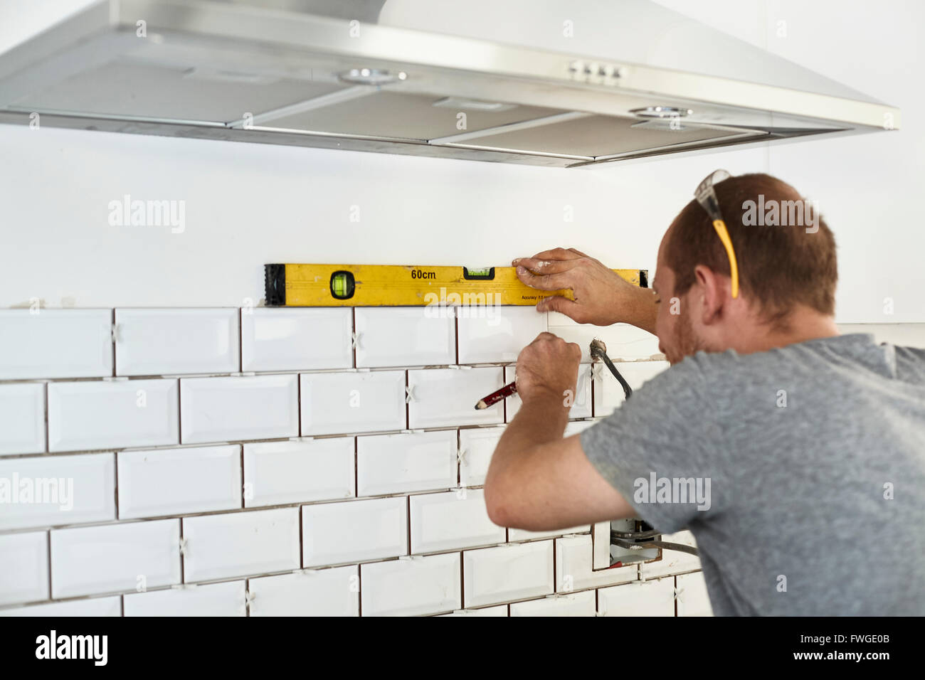 Applying tiles hi-res stock photography and images - Alamy