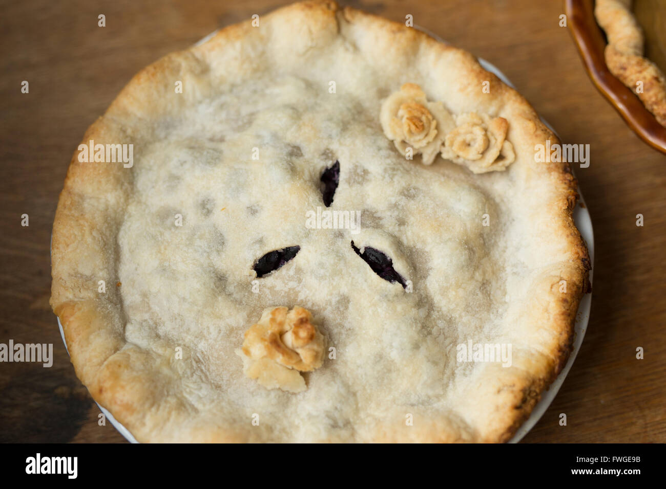 Overhead view of a freshly baked home made pie with pastry top and ...