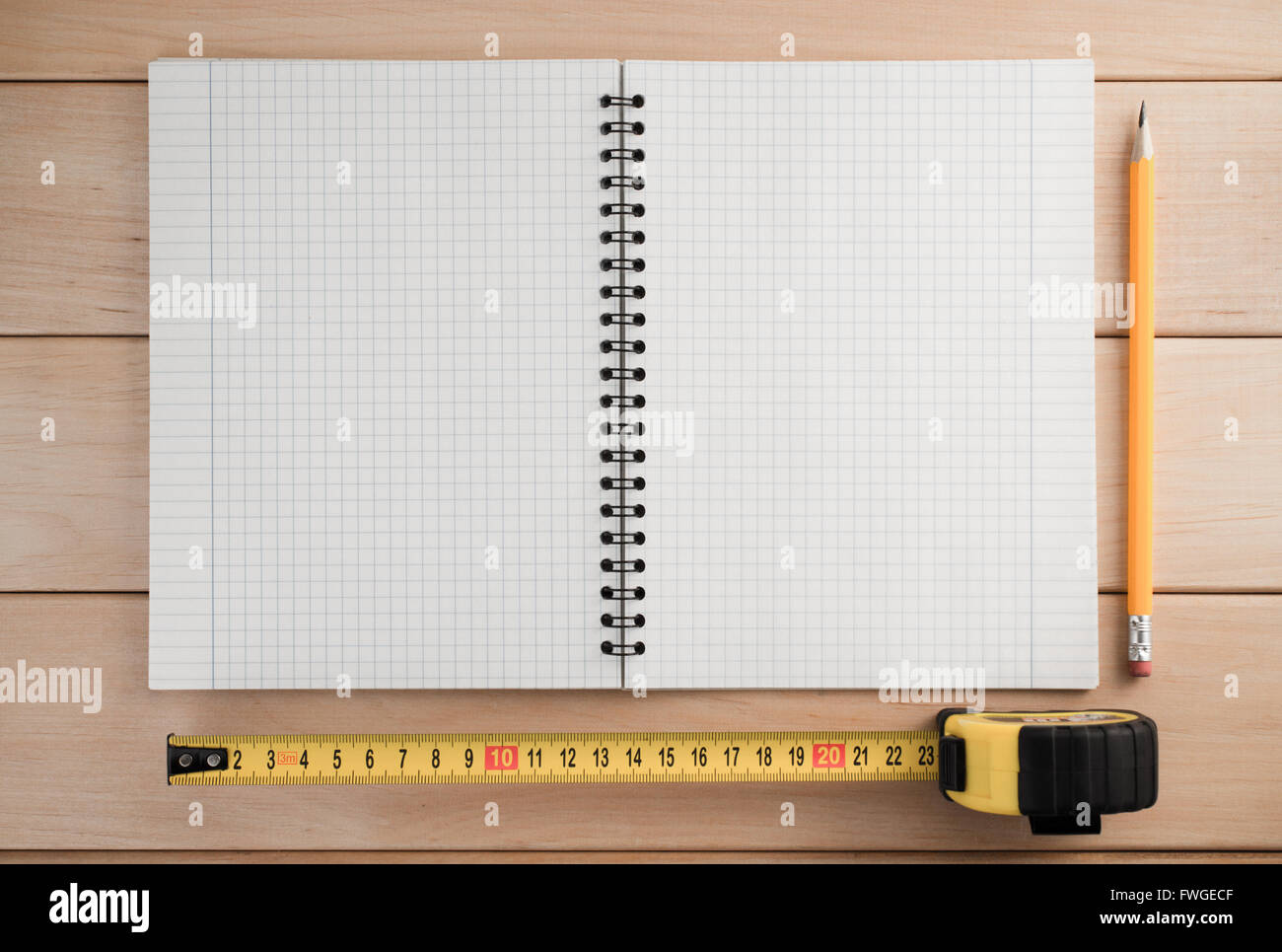 tape measure and pencil on wooden texture Stock Photo - Alamy