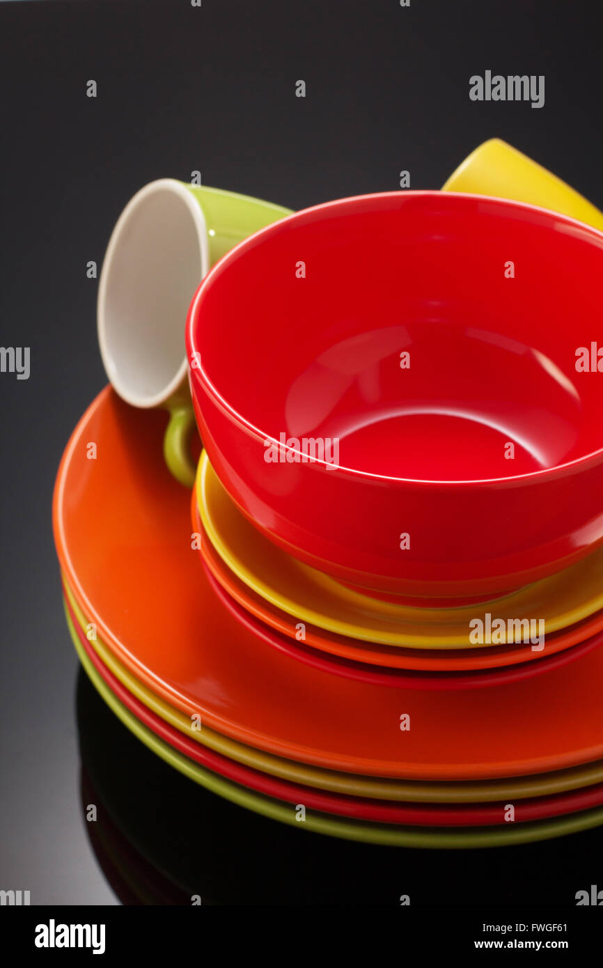 set of dishware on black background Stock Photo - Alamy