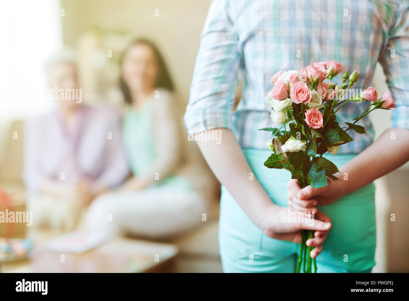 Fresh flowers in hands Stock Photo - Alamy