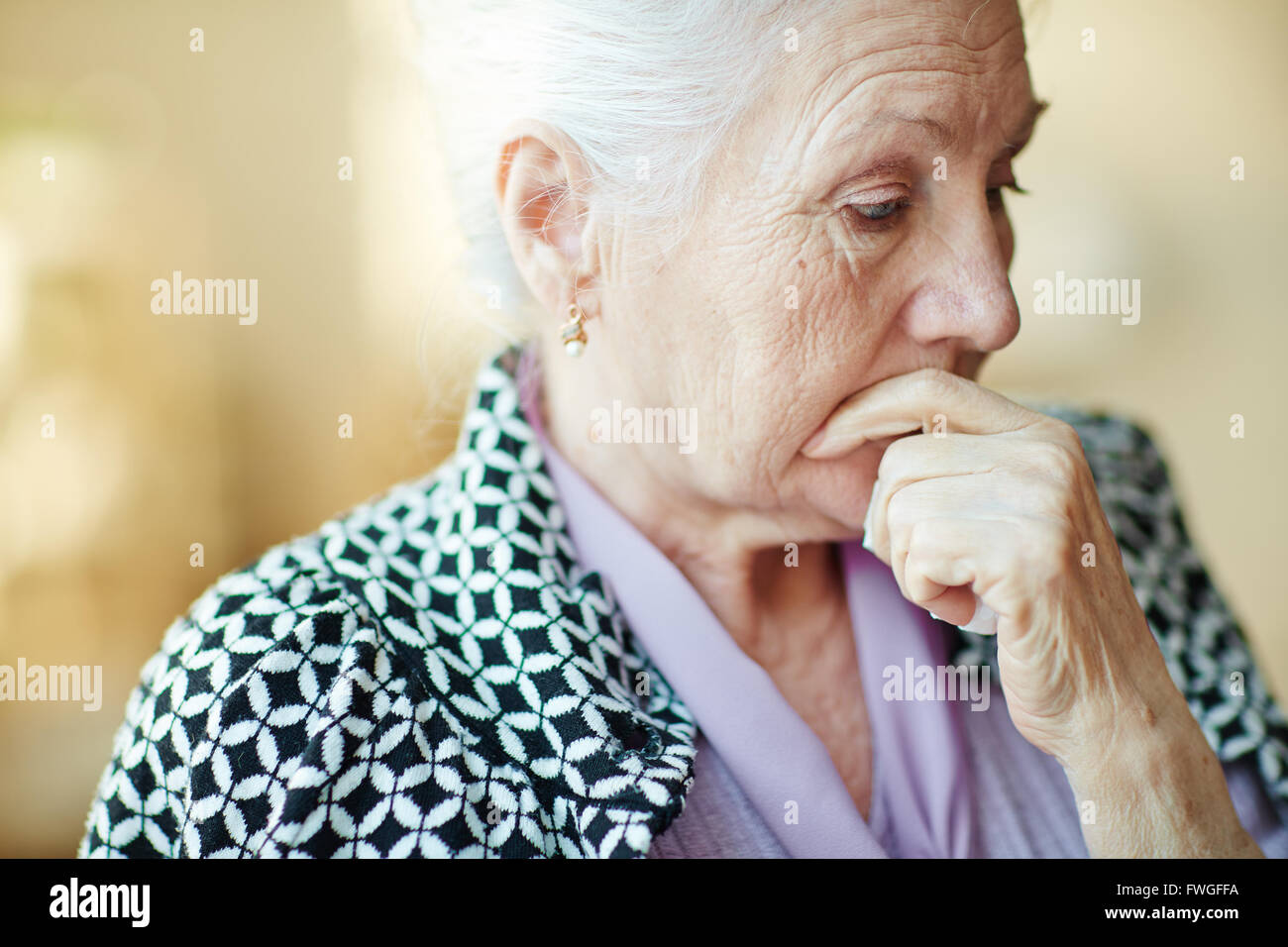 Pensive senior woman Stock Photo - Alamy