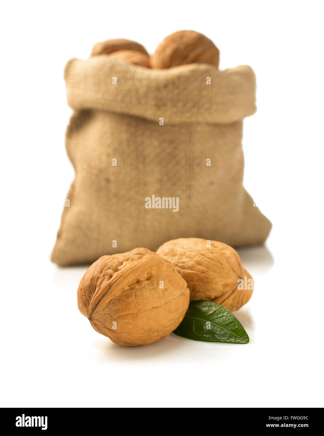 walnuts in bag isolated on white background Stock Photo - Alamy