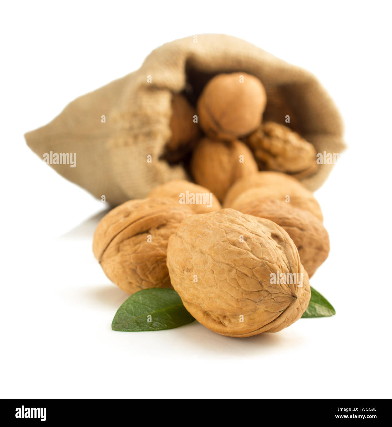 walnuts in bag isolated on white background Stock Photo - Alamy