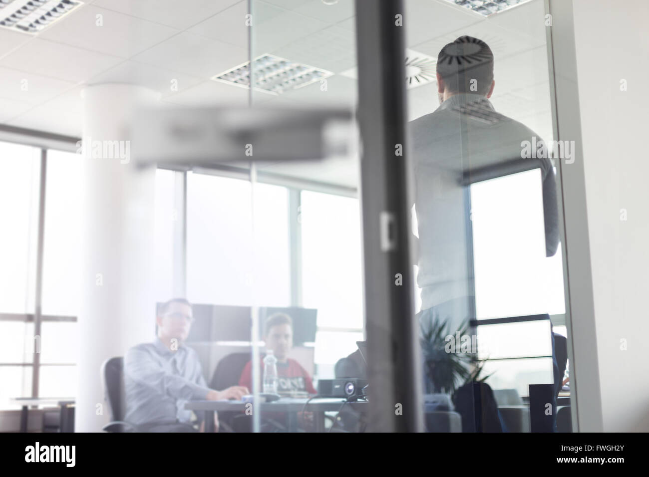 Business team leader delivering presentation in office Stock Photo - Alamy