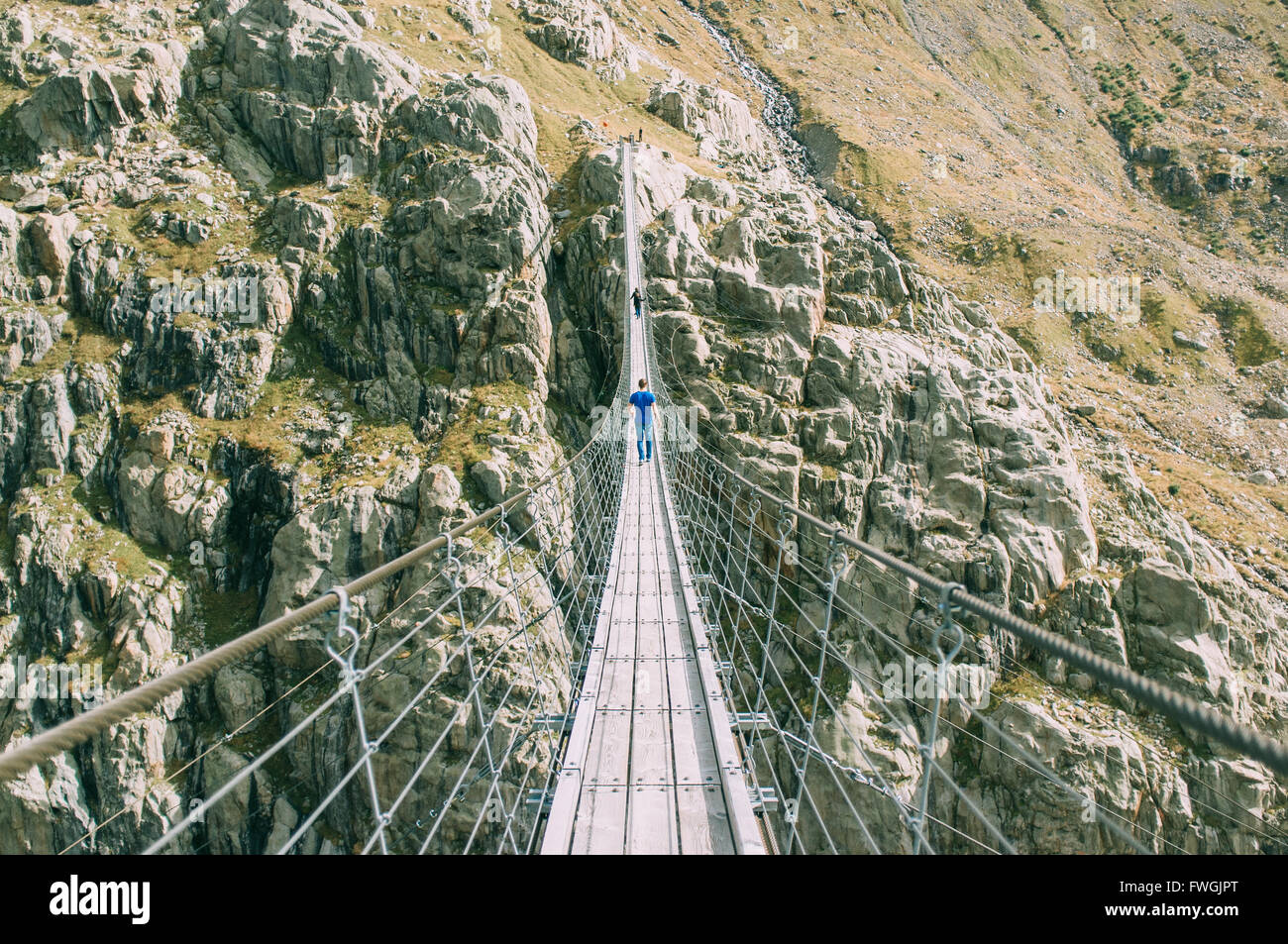 Rope bridge over rocks hi-res stock photography and images - Alamy