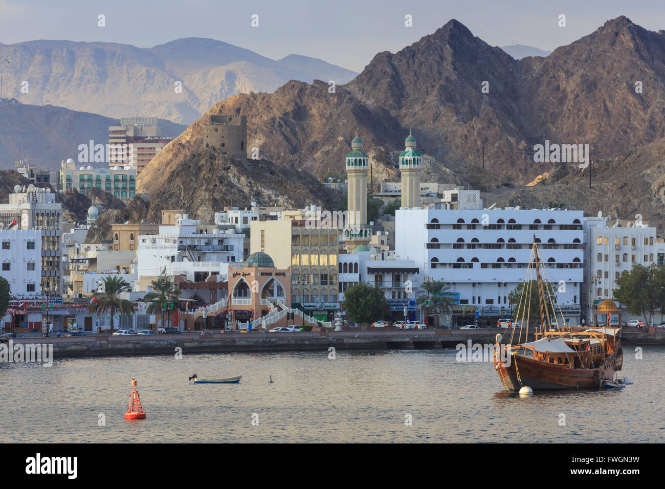 Mutrah Corniche and entrance to Mutrah Souq, backed by mountains ...