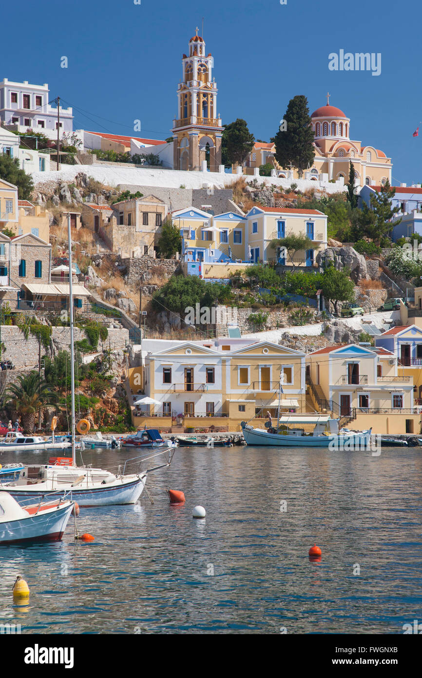 View over harbour to colourful houses and church, Gialos (Yialos), Symi ...
