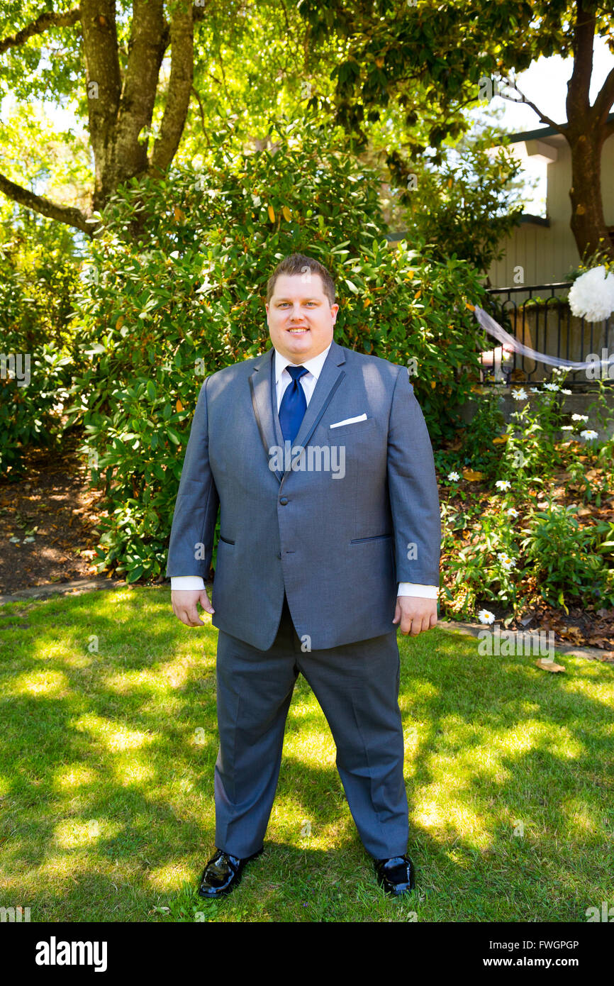 Portraits of a groom on his wedding day while waiting for his bride at ...