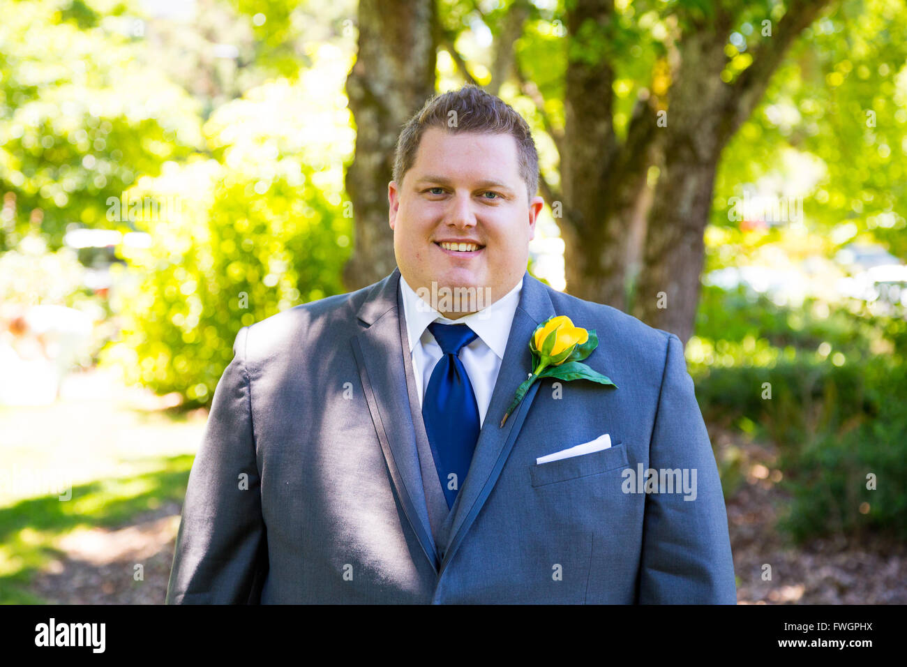Portraits of a groom on his wedding day while waiting for his bride at ...