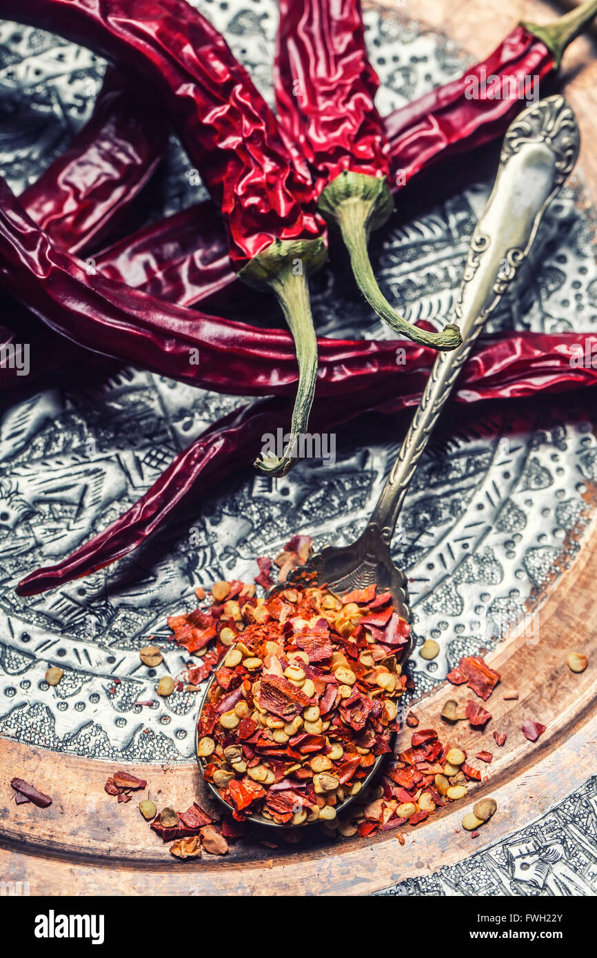 Chili. Chili peppers. Several dried chilli peppers and crushed peppers ...