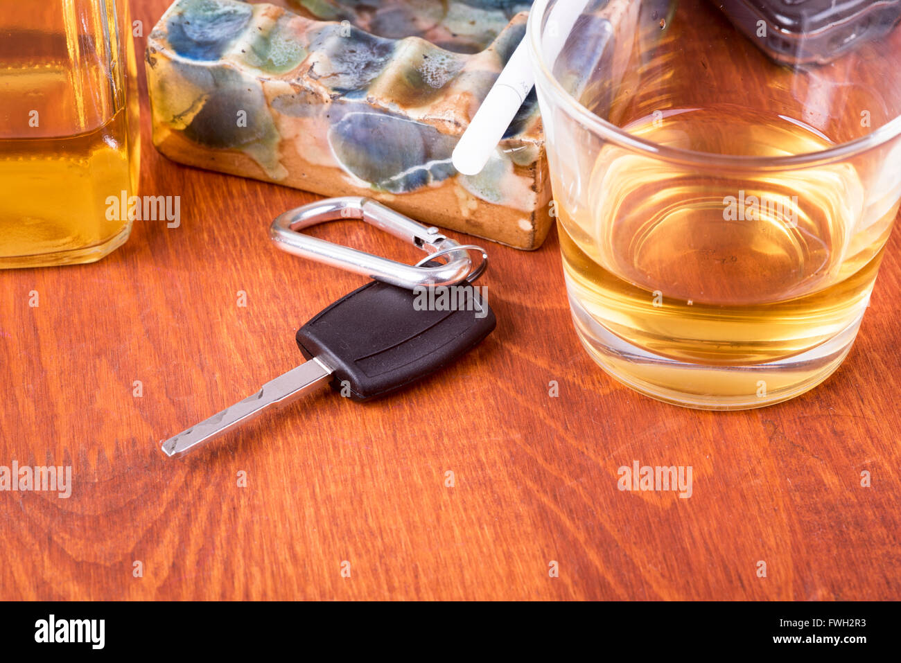a photo of alcohol, car keys which equals tragedy on the road Stock ...