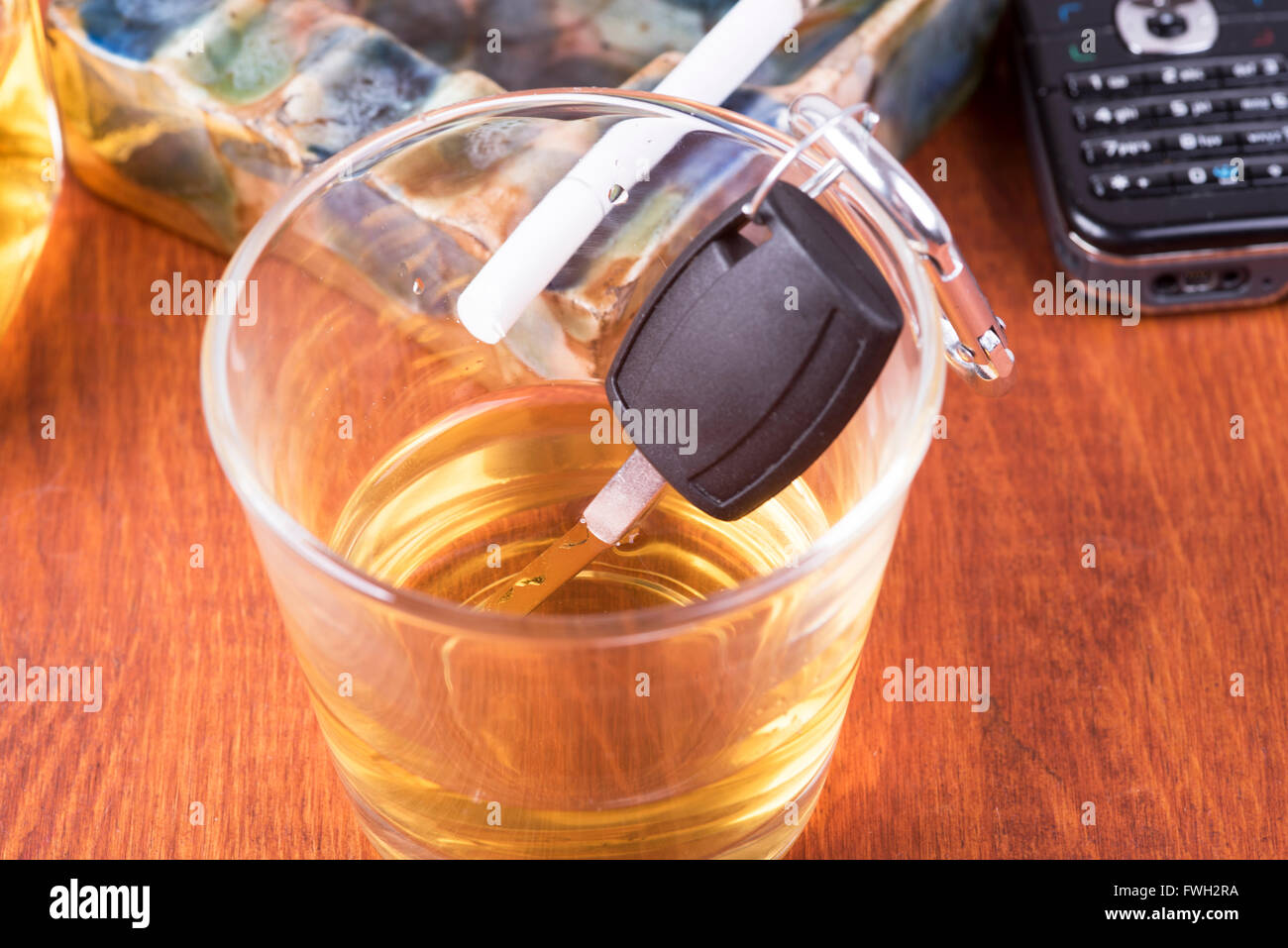 a photo of alcohol, car keys which equals tragedy on the road Stock ...