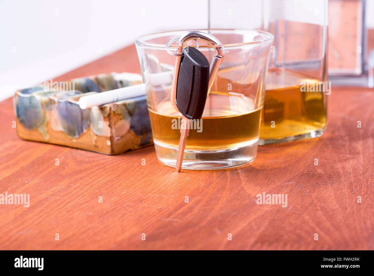 a photo of alcohol, car keys which equals tragedy on the road Stock ...