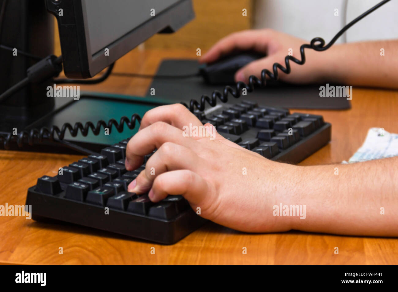 Male hands for computer keyboard in office Stock Photo - Alamy