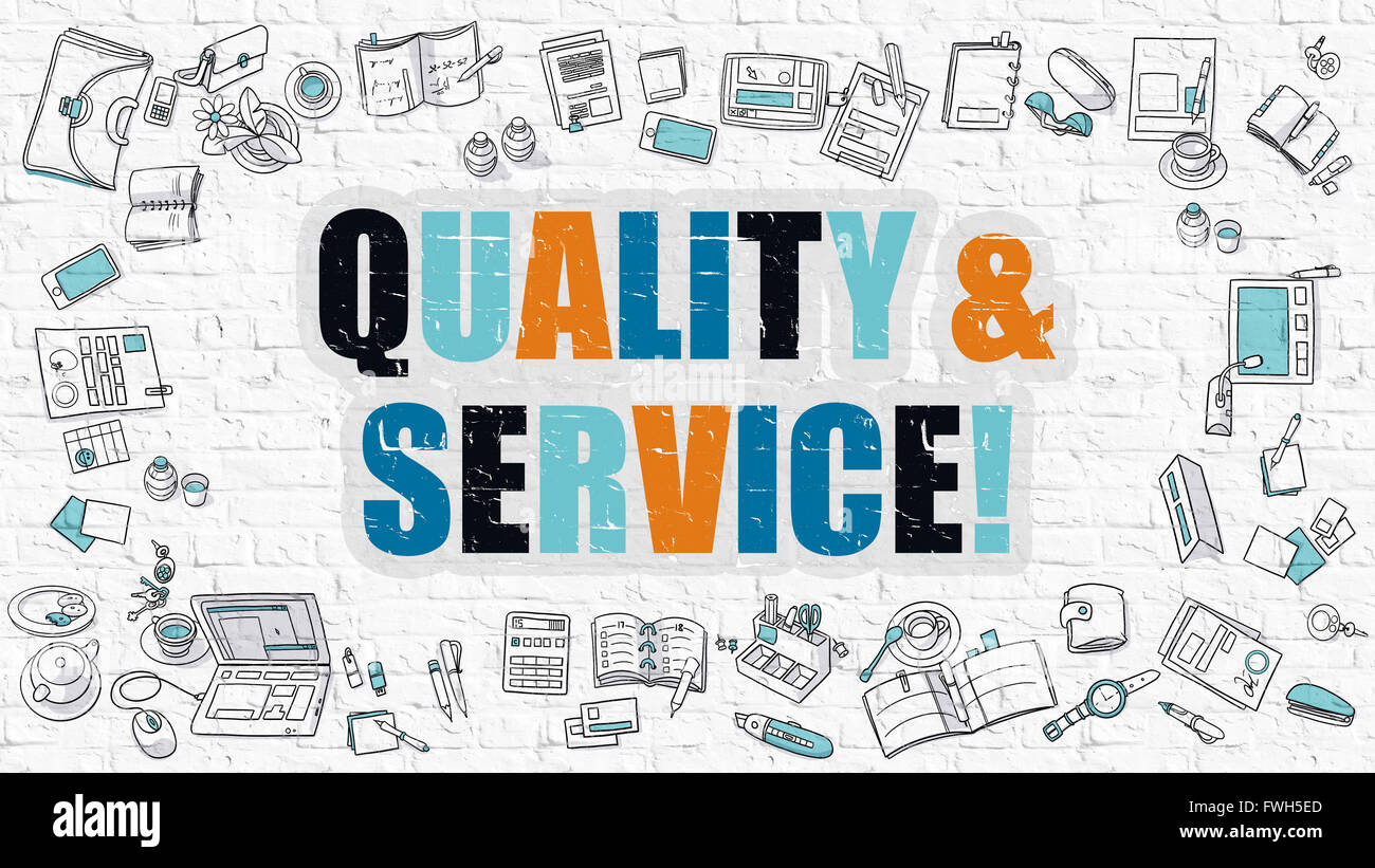 Quality and Service on White Brick Wall Stock Photo - Alamy